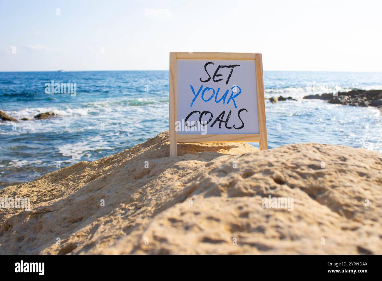 Set your Goals symbol. White Blackboard with Concept words Set your ...