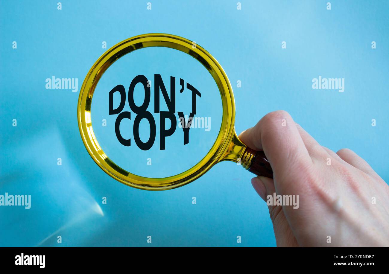 Don't copy symbol. Magnifying Glass with Concept word Don't copy ...