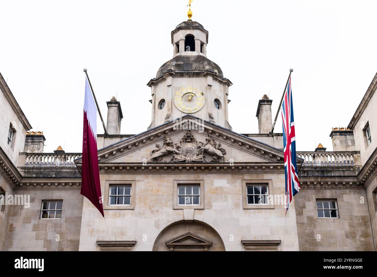 The Union Jack and Qatar's flag fly side by side atop the Royal Horse ...