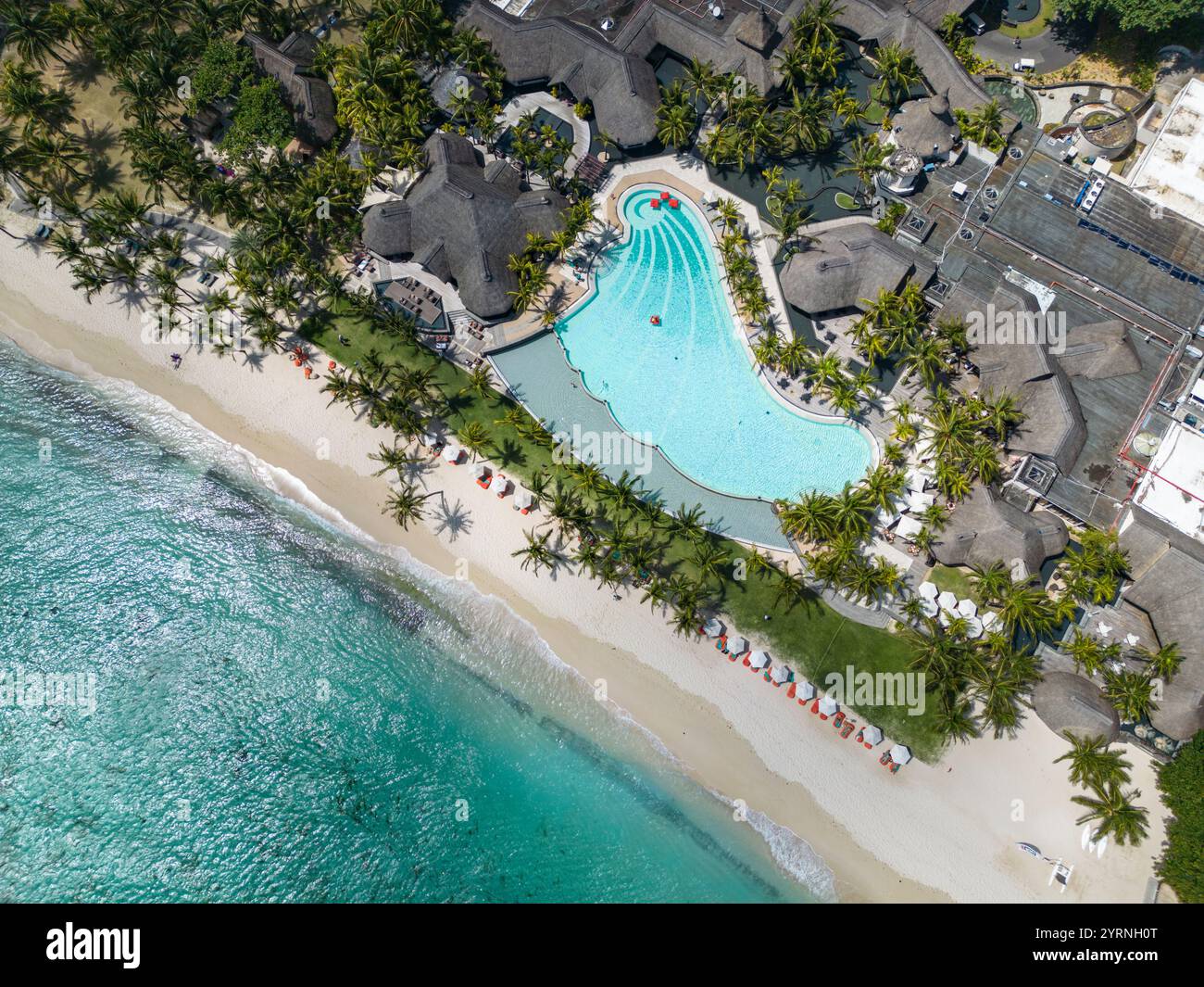 Aerial of beach and swimming pool at Dinarobin Beachcomber Golf Resort ...