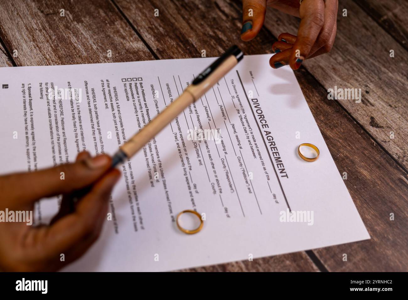 Couple finalizing their divorce with signed agreement and removed ...