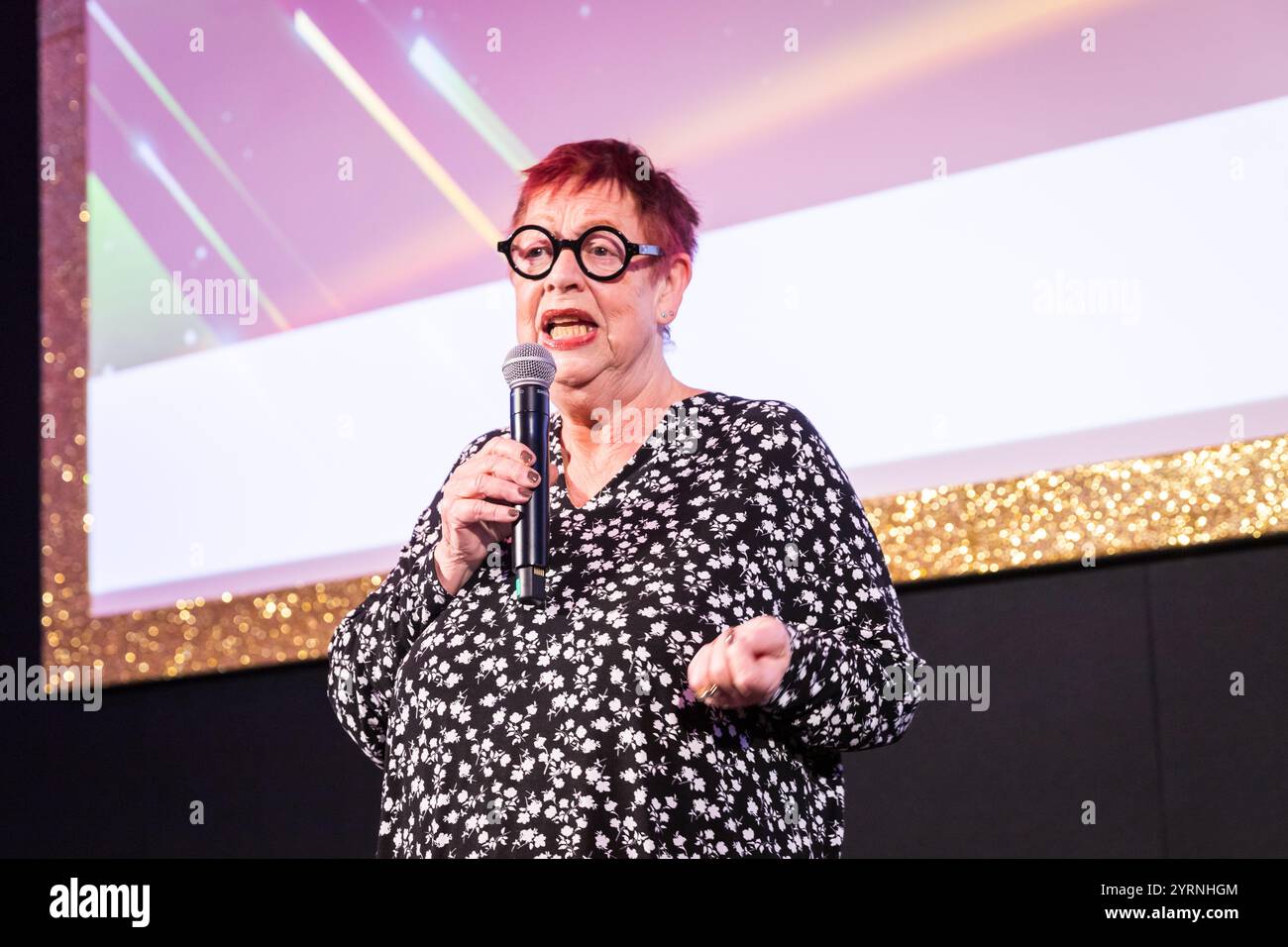 Jo Brand speaking in a microphone Stock Photo - Alamy
