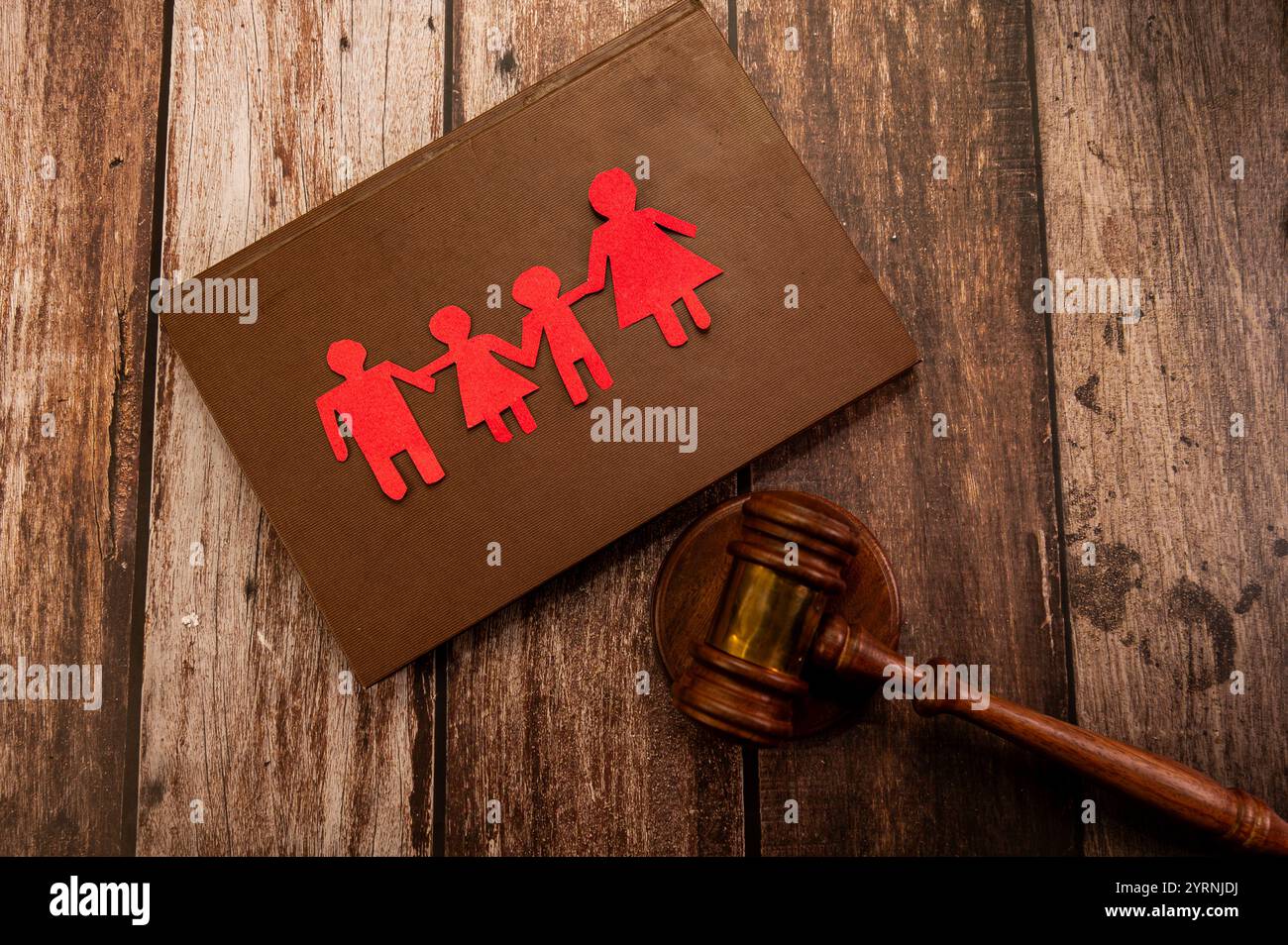 Paper family, gavel, and law book symbolize legal battles over child ...
