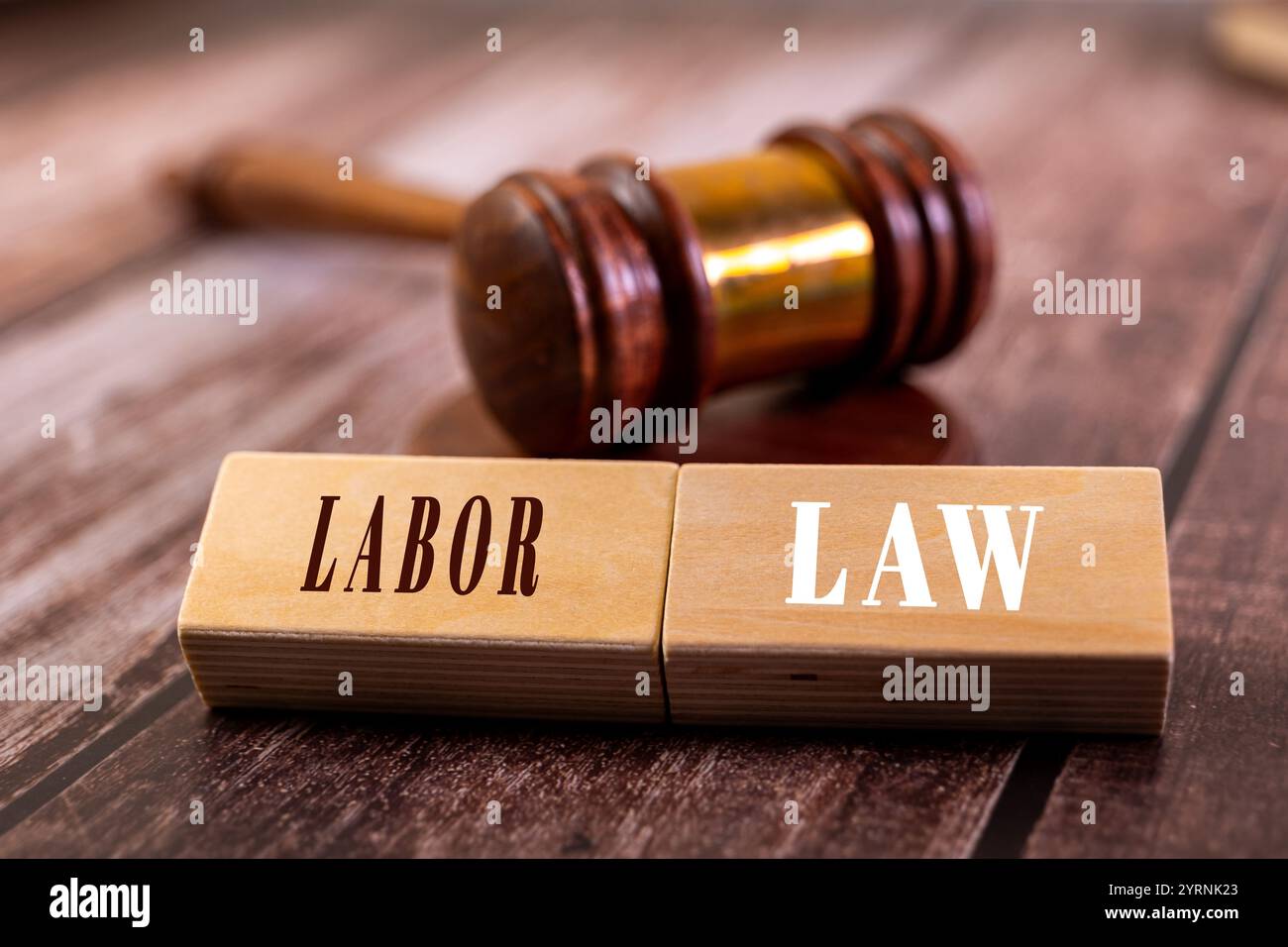 Labor law concept with wooden blocks and gavel. Legal, employment, and ...