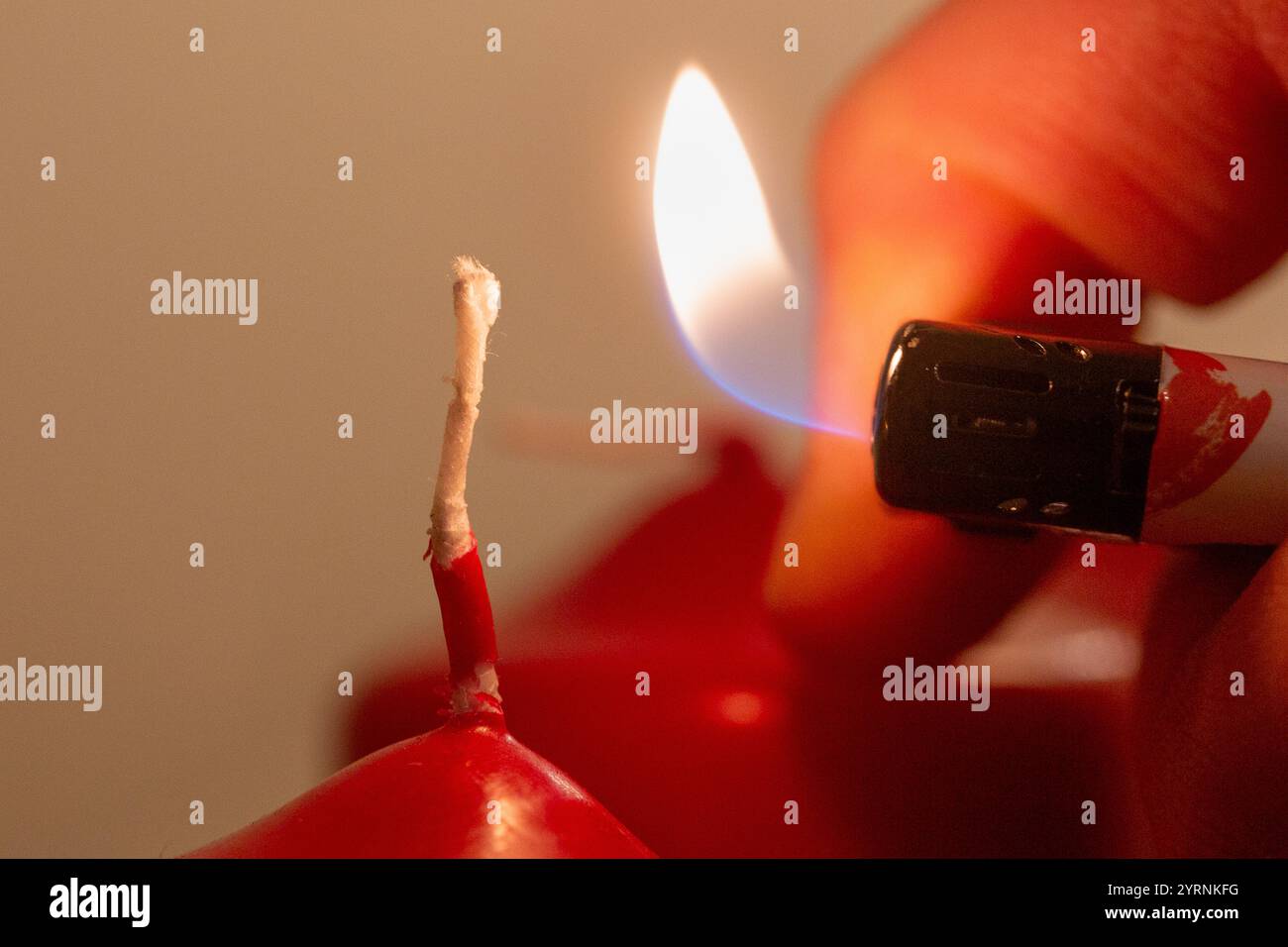 Berlin, Germany. 26th Nov, 2024. An Advent candle is lit with a lighter ...