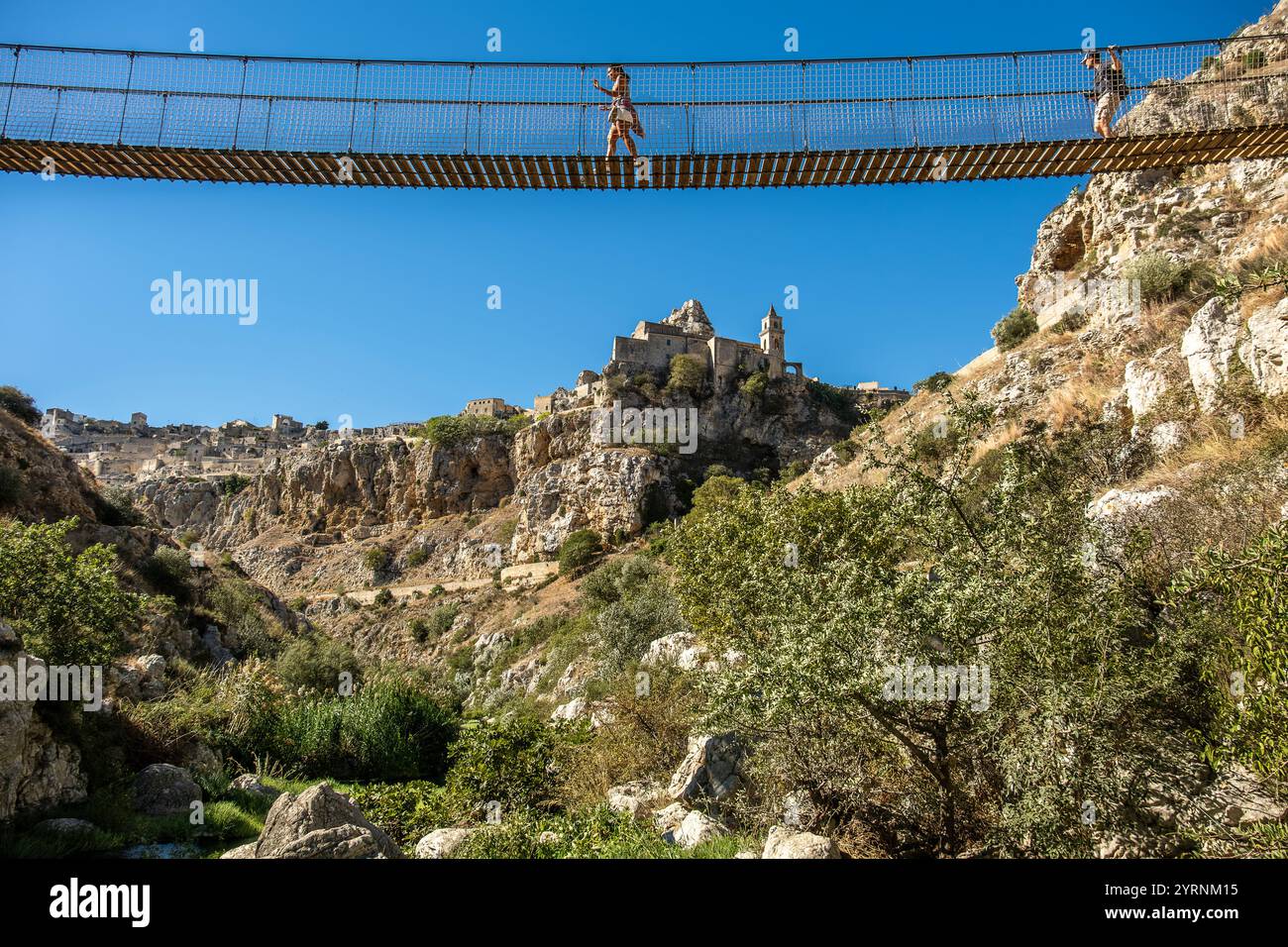 People crossing the bridge of the Murgia Materana park (Parco della ...