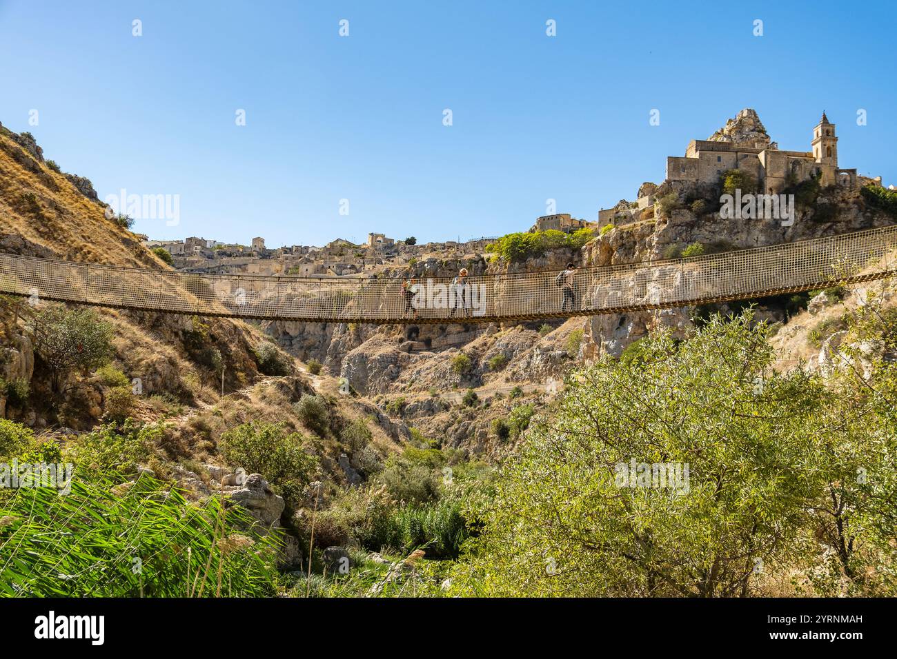 People crossing the bridge of the Murgia Materana park (Parco della ...