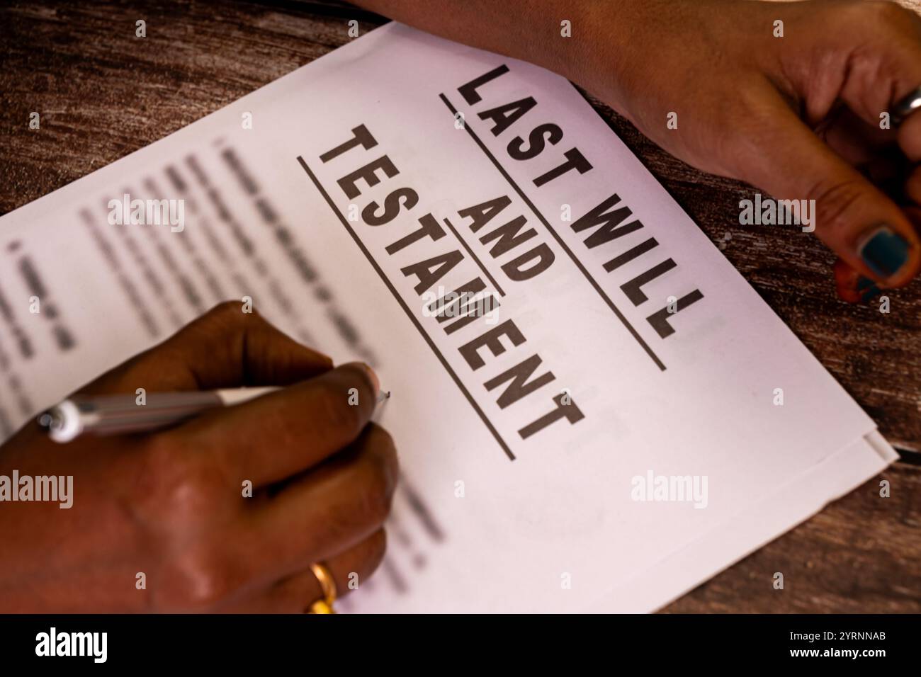 Woman signs last will and testament, ensuring her legacy. Estate ...