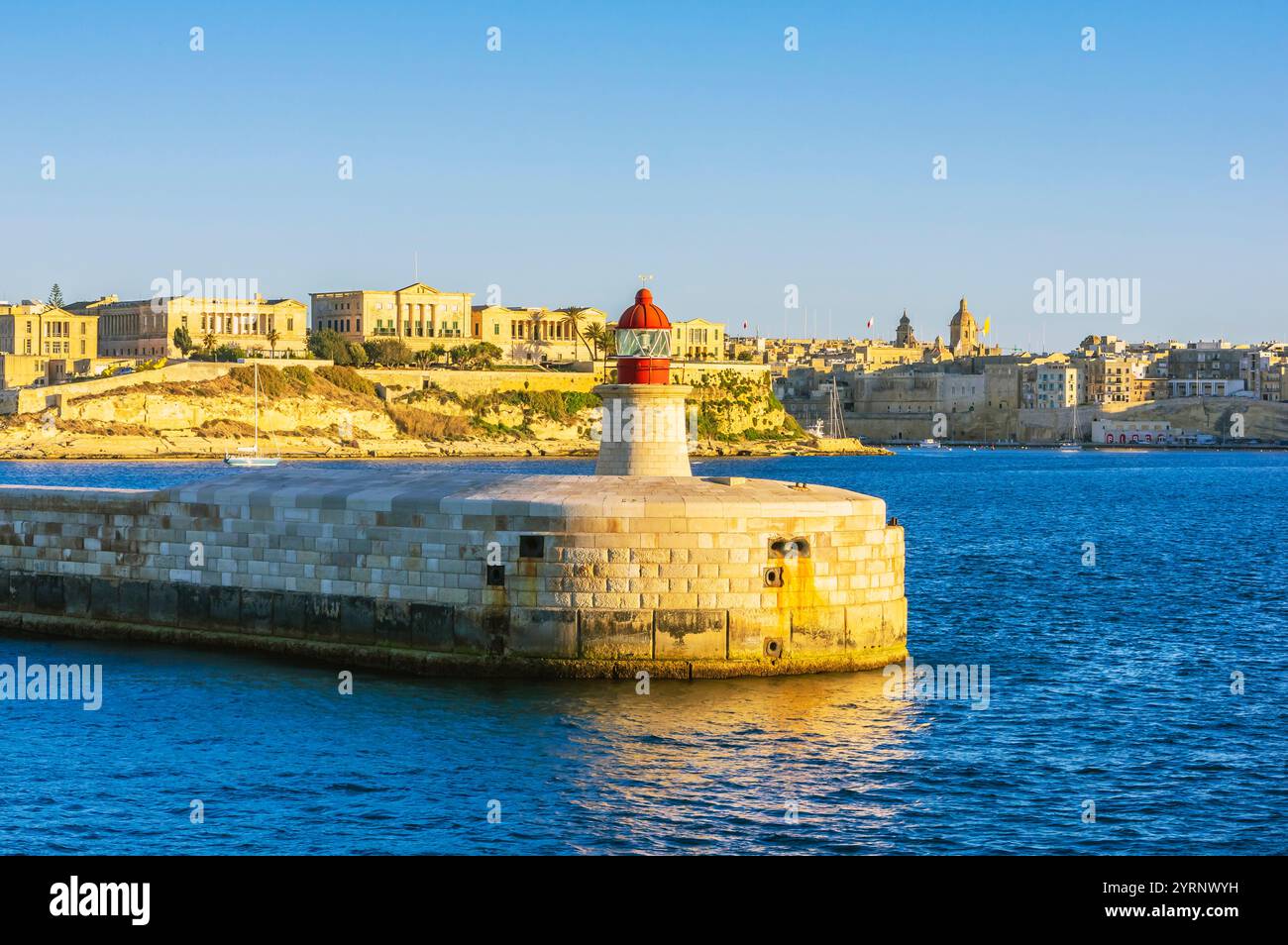 Exit of Valletta harbor with view of lighthouse and Fort Rikasol, Malta ...
