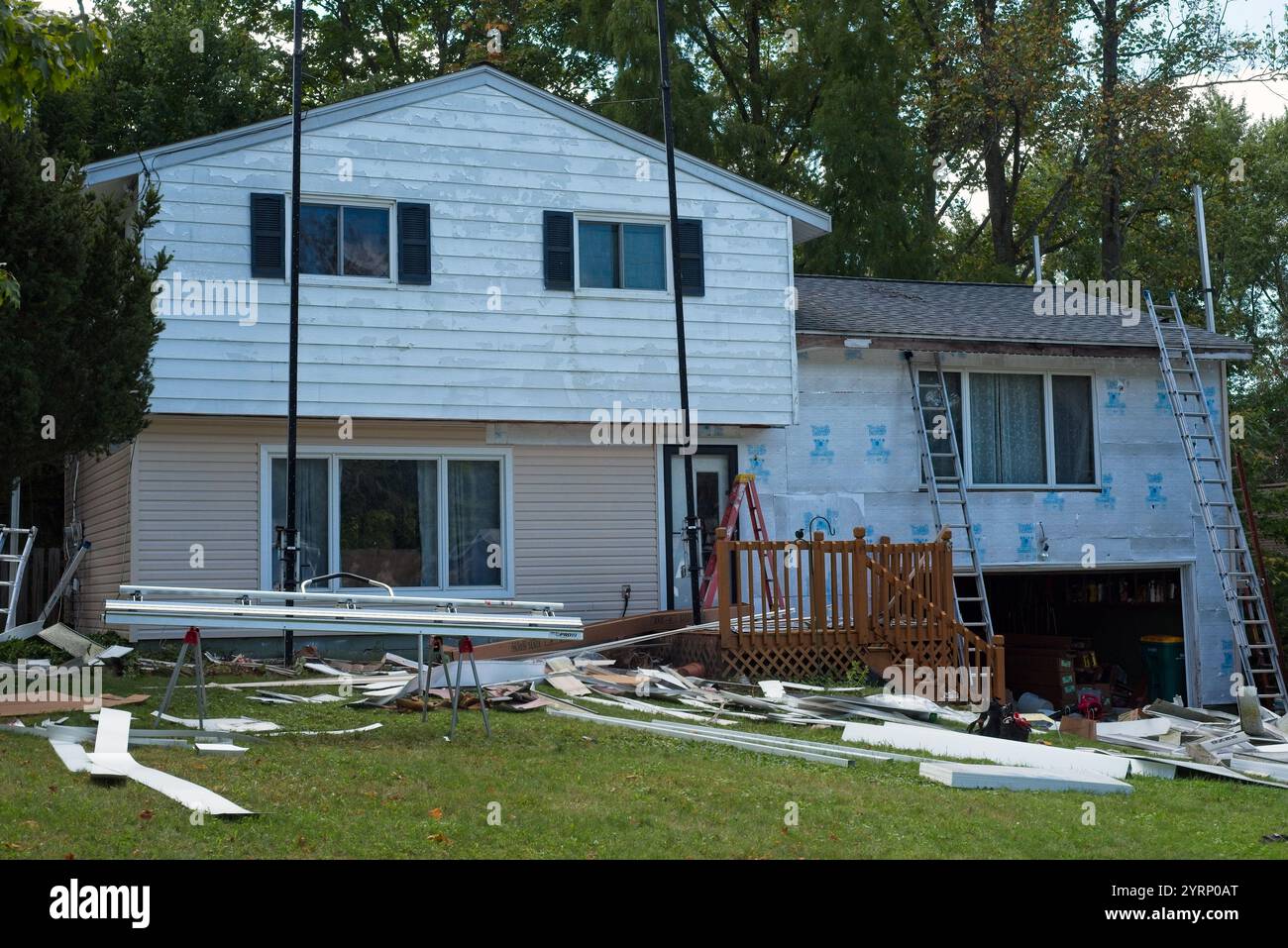 Three stages of a home re-siding project Stock Photo - Alamy