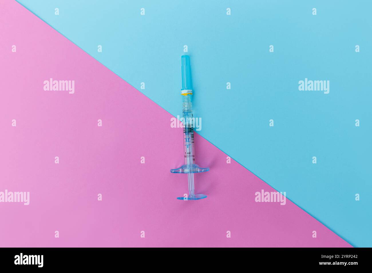Medical preparation injection filler lies on pink and blue background ...