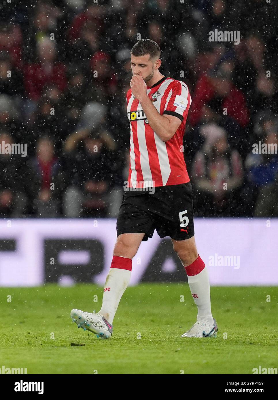 Southampton's Jack Stephens leaves the pitch after being shown a red ...