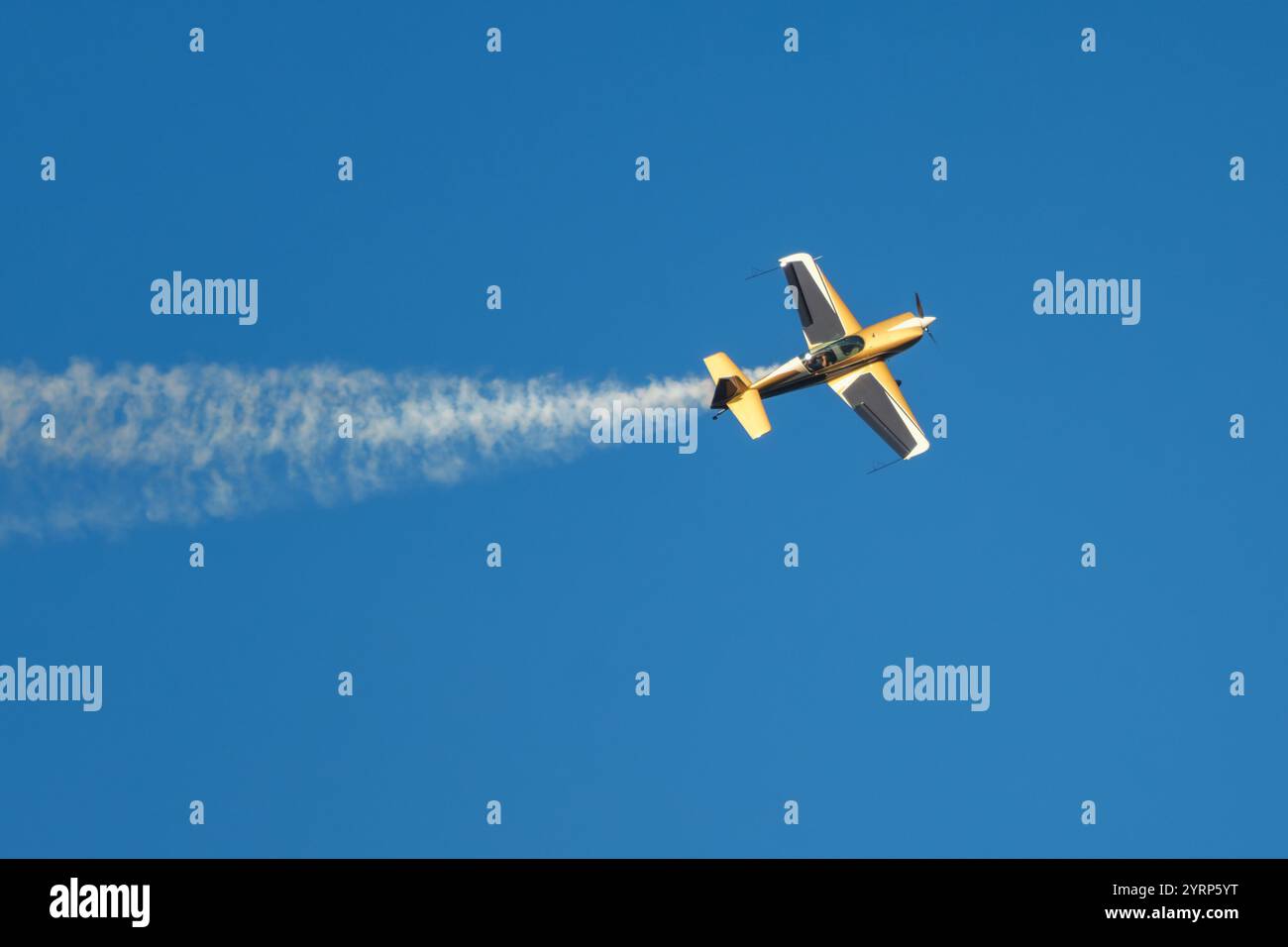 Stunt aerobatic plane performing stunts in air Stock Photo - Alamy