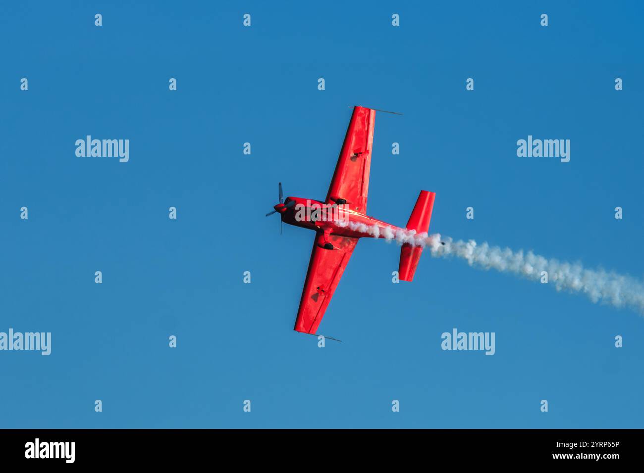 Stunt aerobatic plane performing stunts in air Stock Photo - Alamy