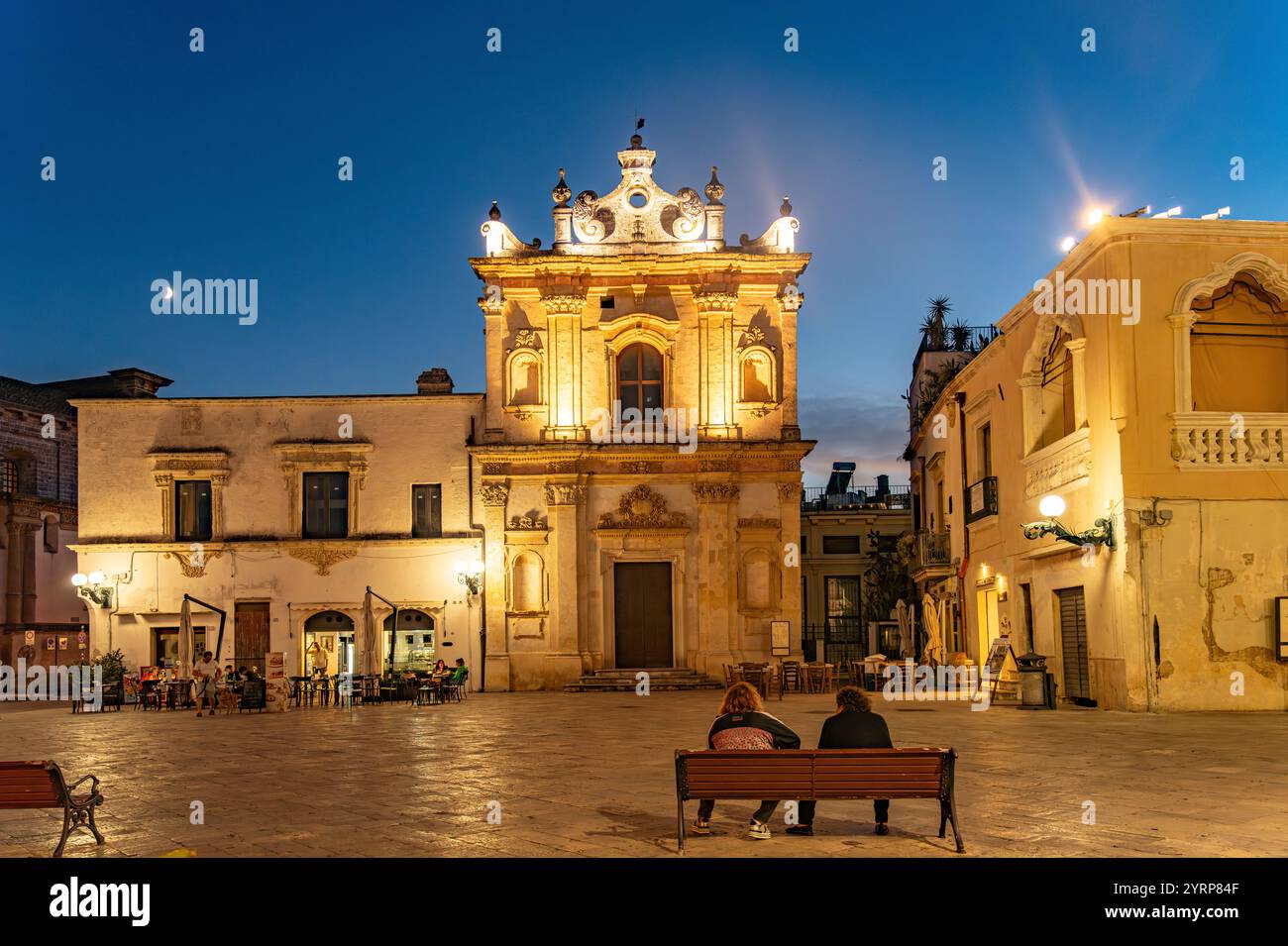 The church Chiesa di San Trifone on the square Piazza Salandra at dusk ...
