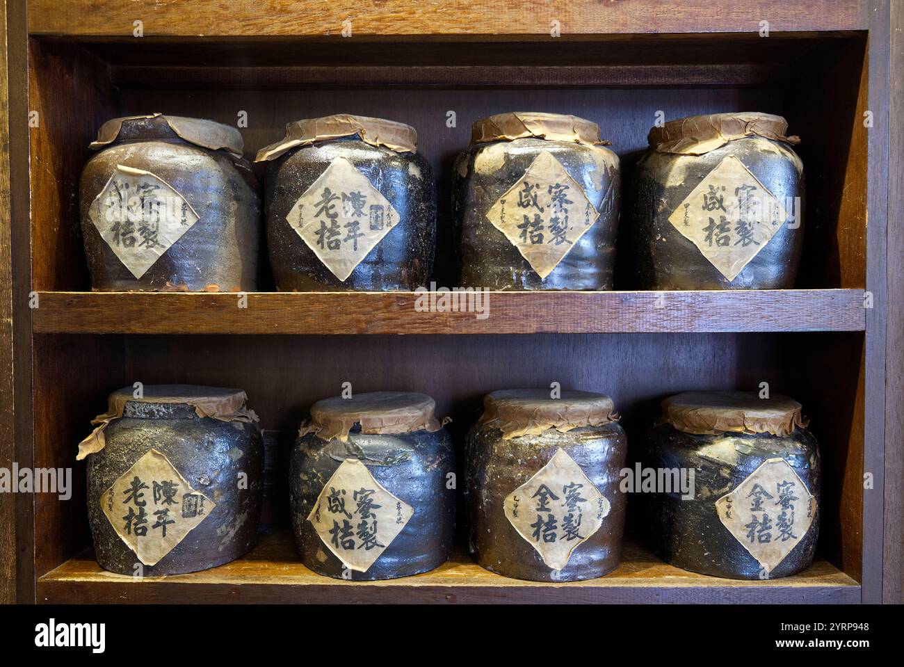 traditional chinese ceramic jars for medicine on wooden shelf Stock ...