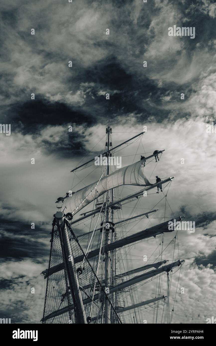 Crew of tall ship high on the rigging Stock Photo - Alamy
