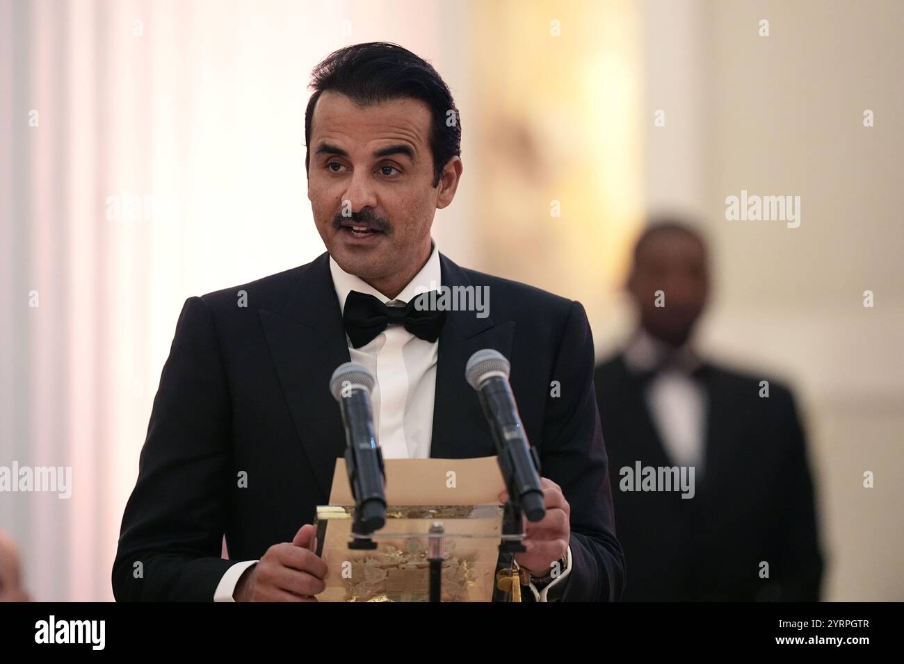 The Emir of Qatar Sheikh Tamim bin Hamad Al Thani speaking at a dinner ...