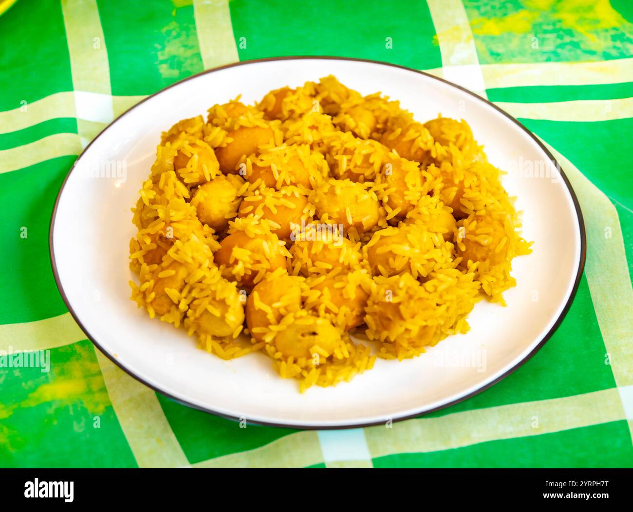 Traditional Brazilian dish chicken with pequi (caryocar brasiliense ...