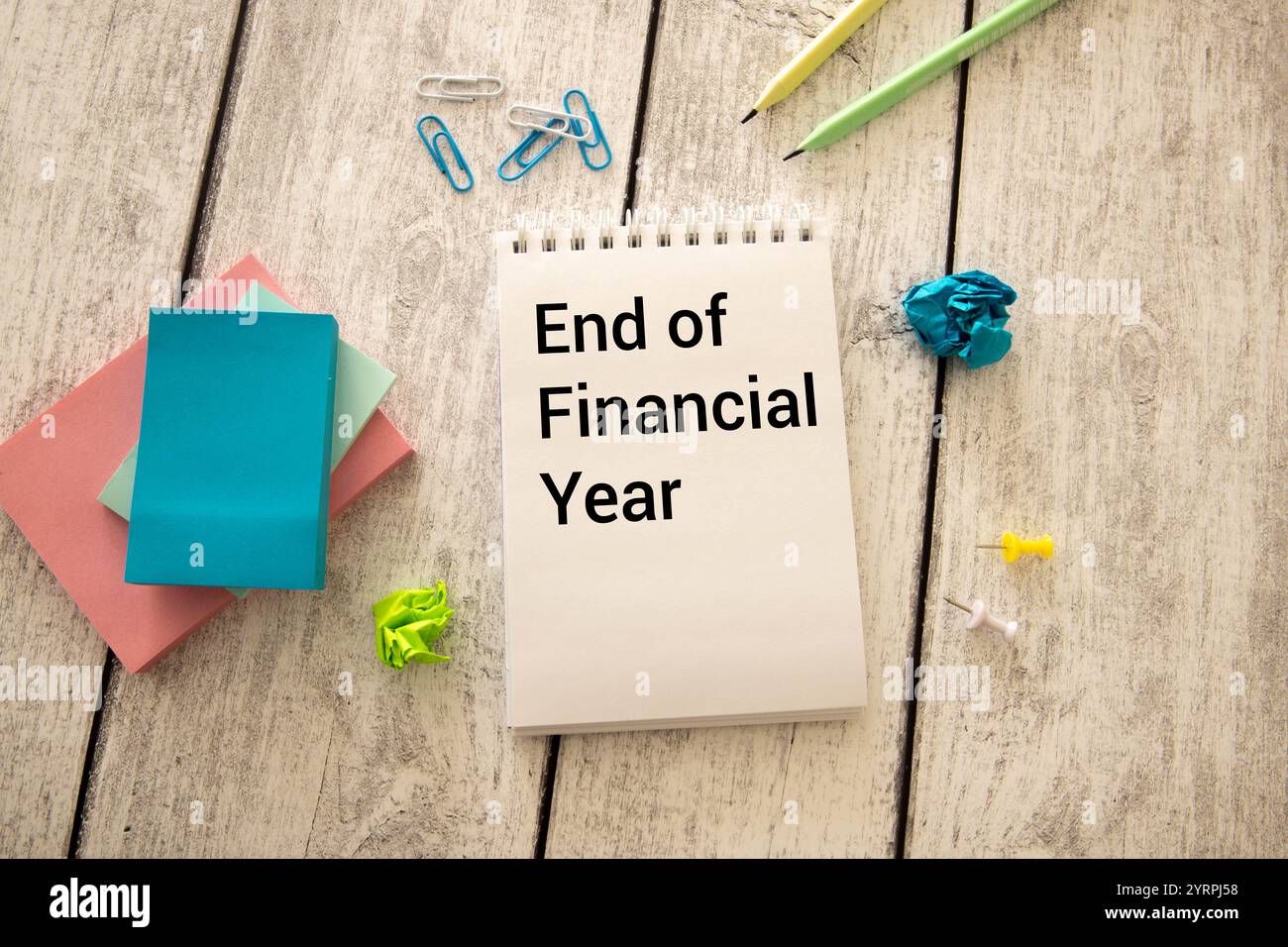 Finance and economics concept. The man is holding a pen and a notebook ...