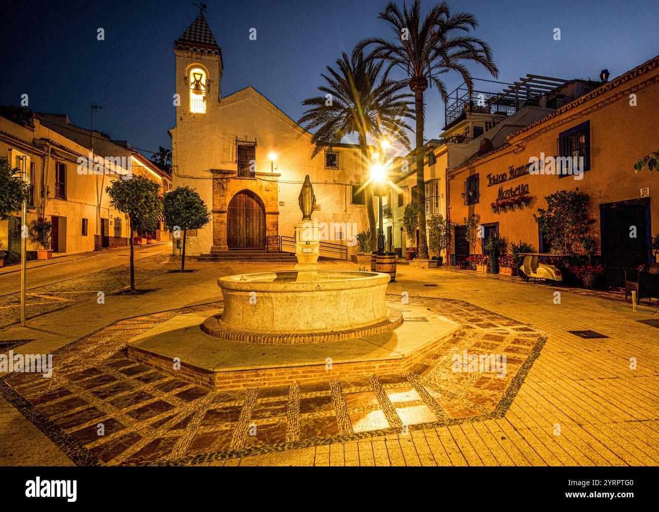 Plaza Santo Cristo at night with fountain and palm trees, in the ...