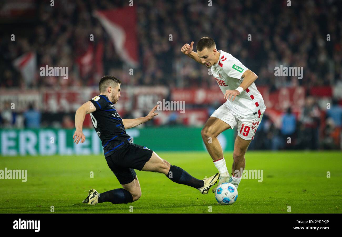 Cologne, Germany. 04th Dec 2024. Tim Lemperle (Köln) Jonjoe Kenny ...