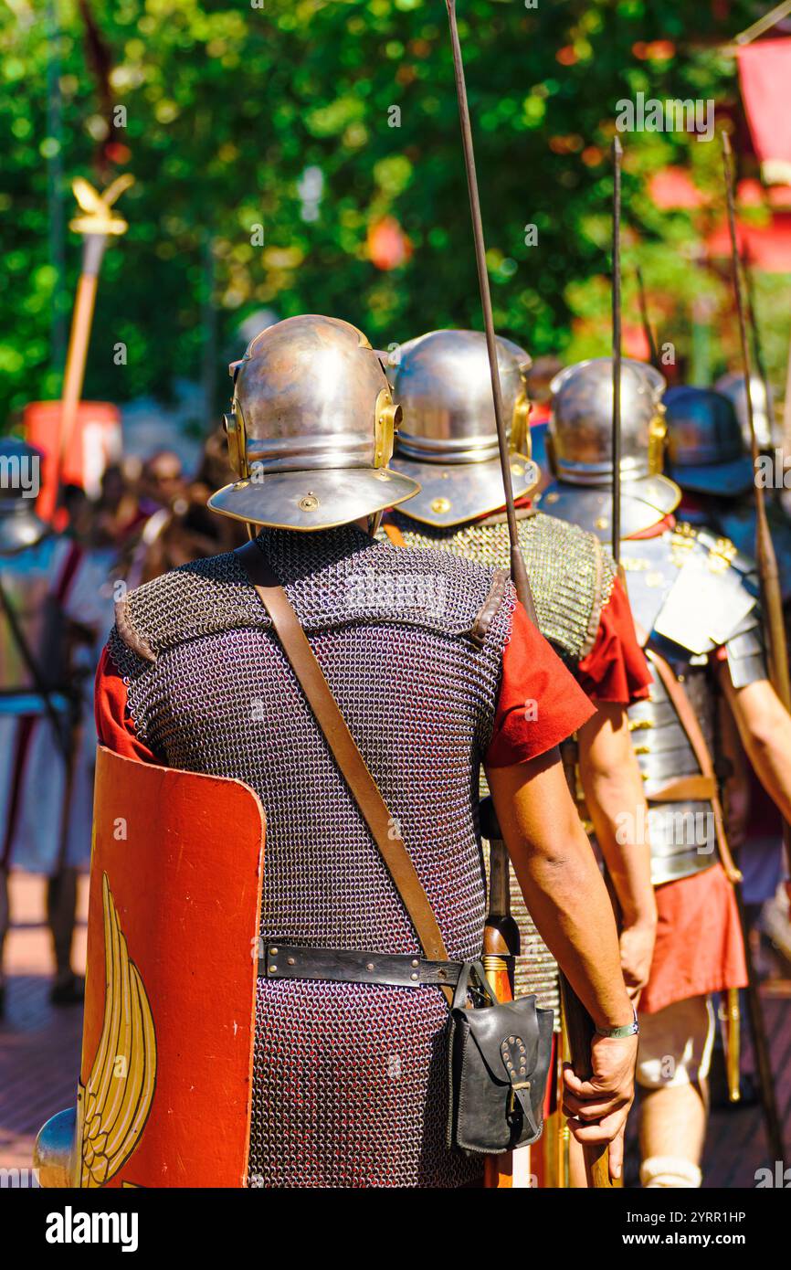 roman legionaries parading in line at a historical reenactment festival ...