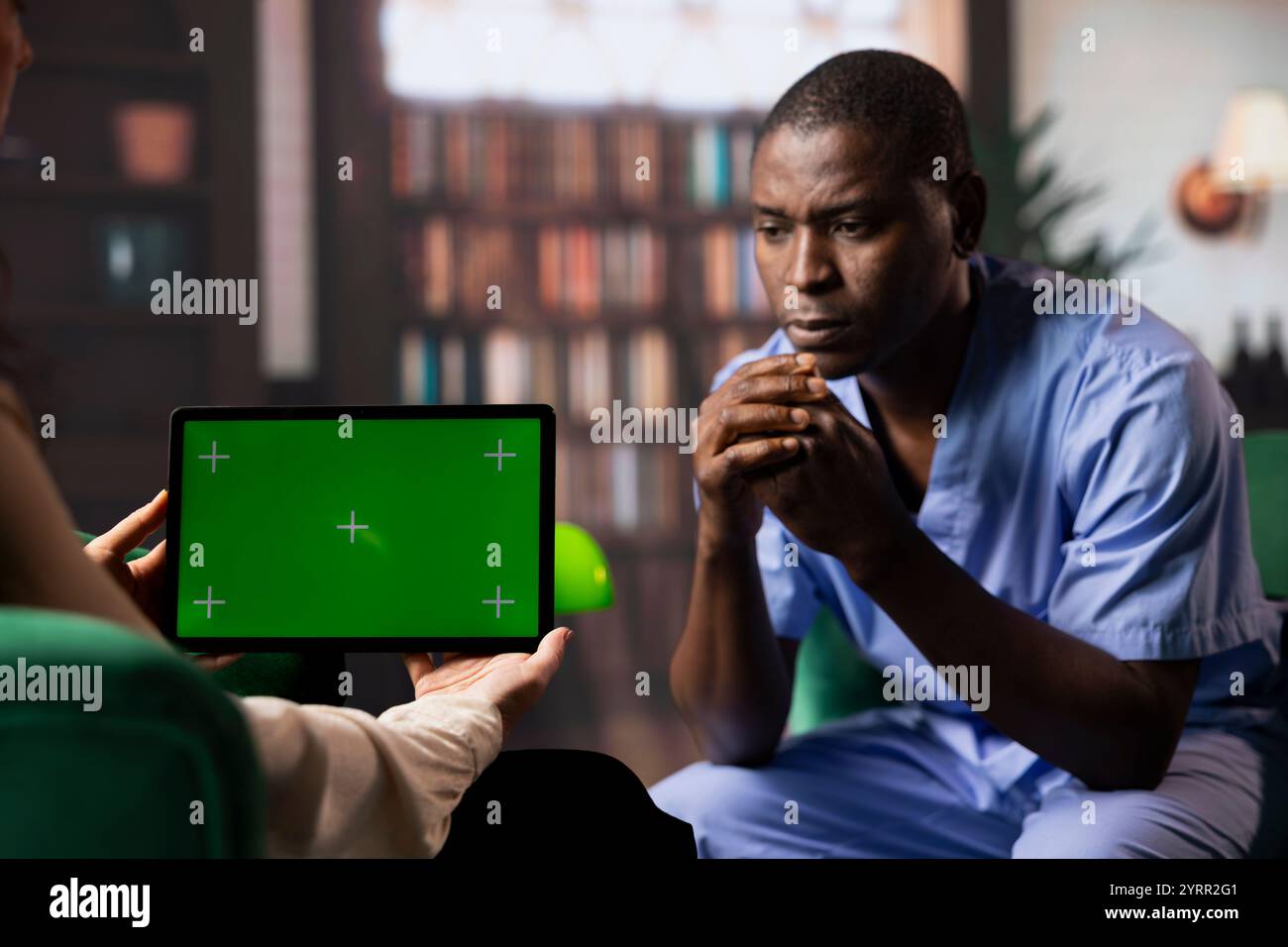 African american medical assistant with chroma key reflects on loss and ...