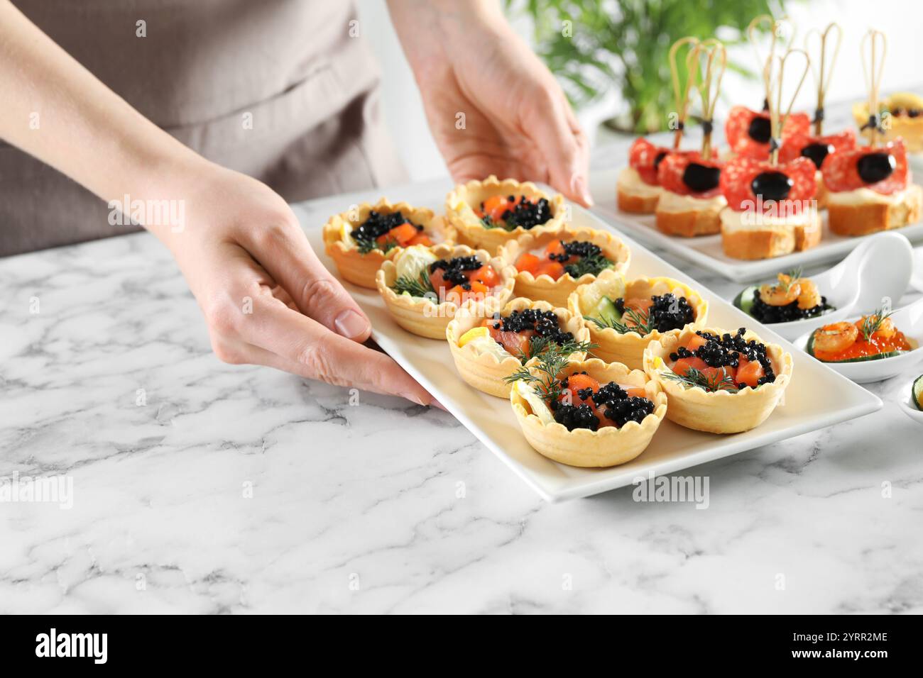 Female hand tasty canapes hi-res stock photography and images - Alamy