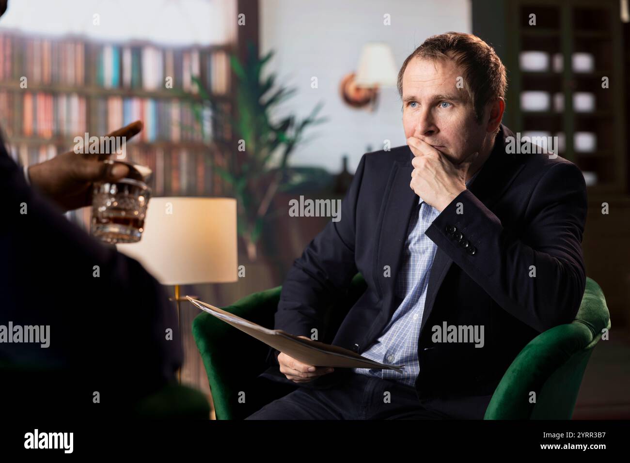 Multiethnic secret service agents in a stylish headquarters library ...