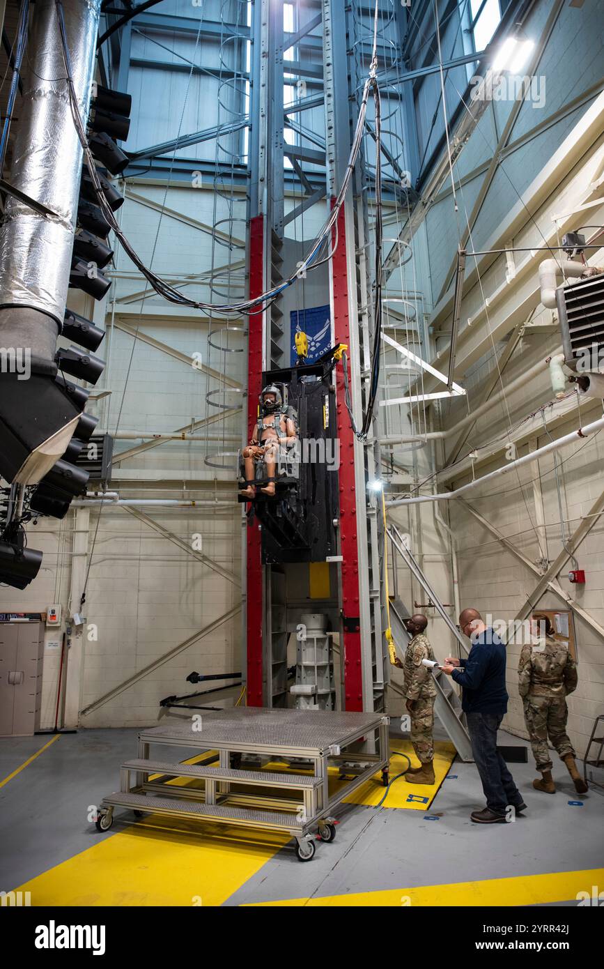 Lab personnel hoist an Anthropomorphic Test Device on the Vertical ...