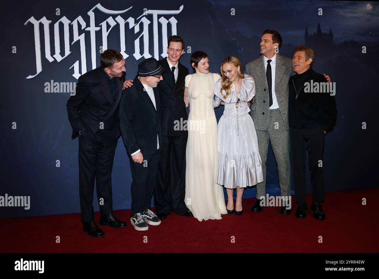 Ralph Ineson, from left, Simon McBurney, Bill Skarsgard, Emma Corrin, Lily-Rose Depp, Nicholas ...