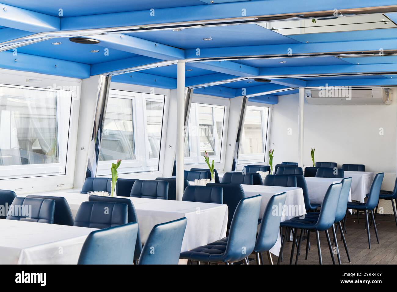 Experience a Modern Dining Area on a Boat featuring a Beautiful Blue ...