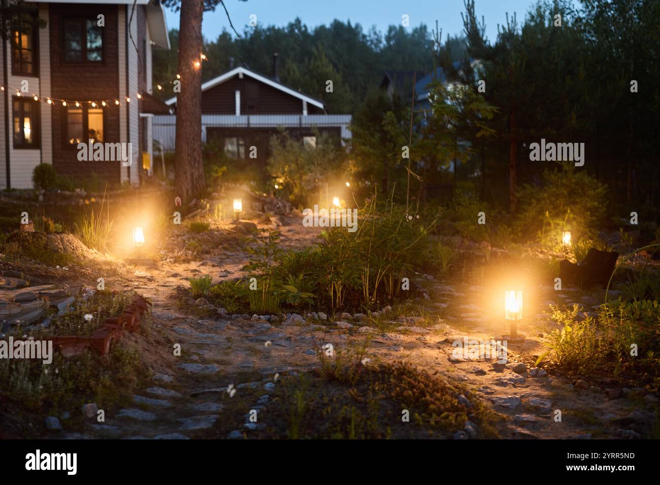 An Enchanting Evening Landscape Featuring a Beautifully Illuminated ...