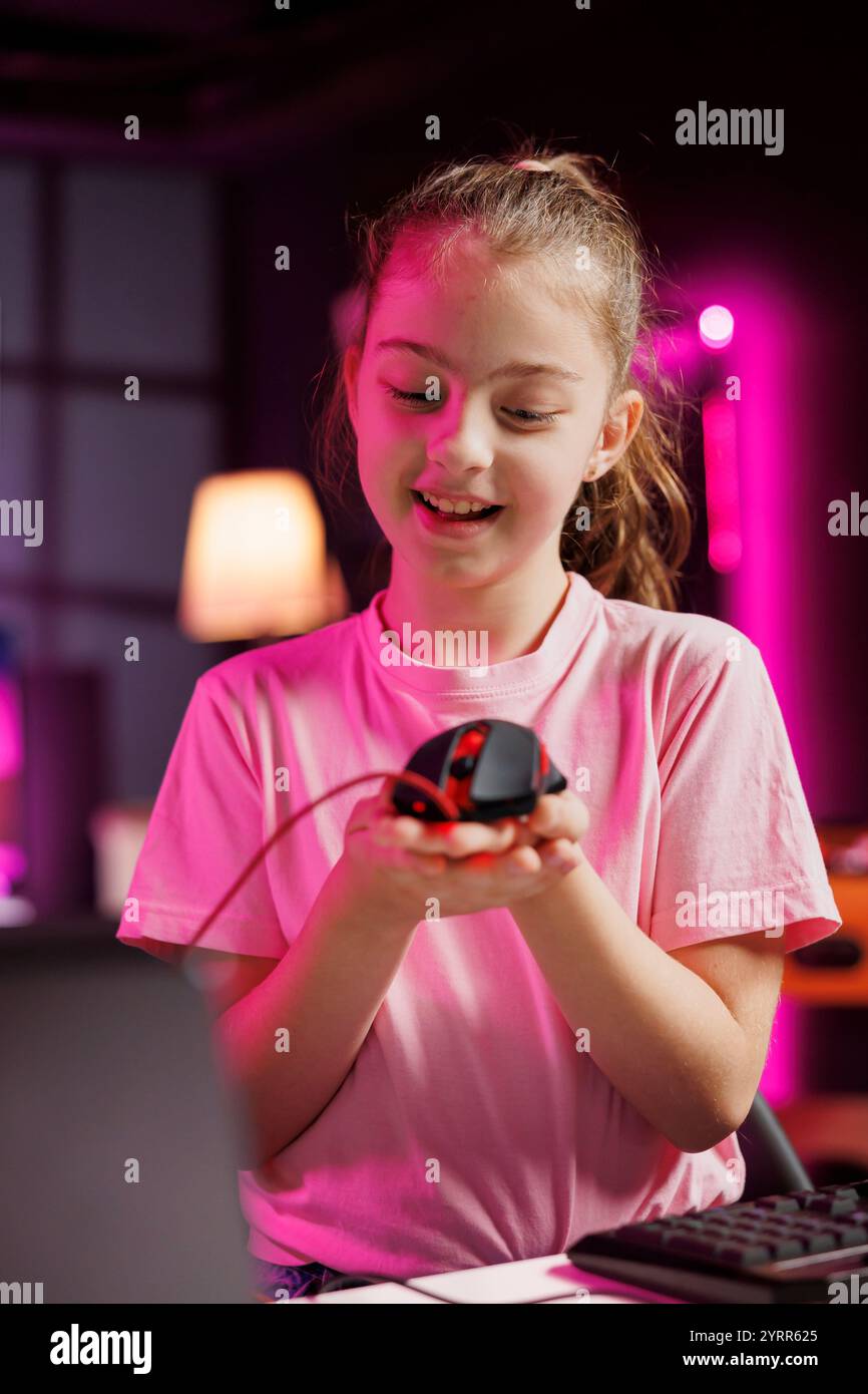 Child influencer filming wired mouse review in home studio, showing ...