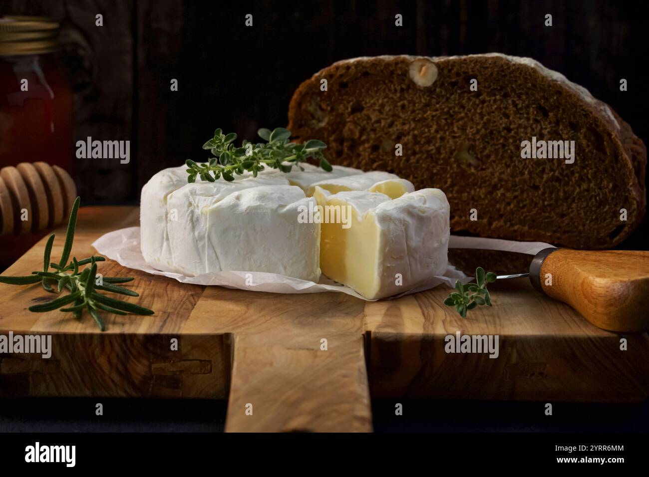 Brie cheese with rustic loaf of bread Stock Photo - Alamy