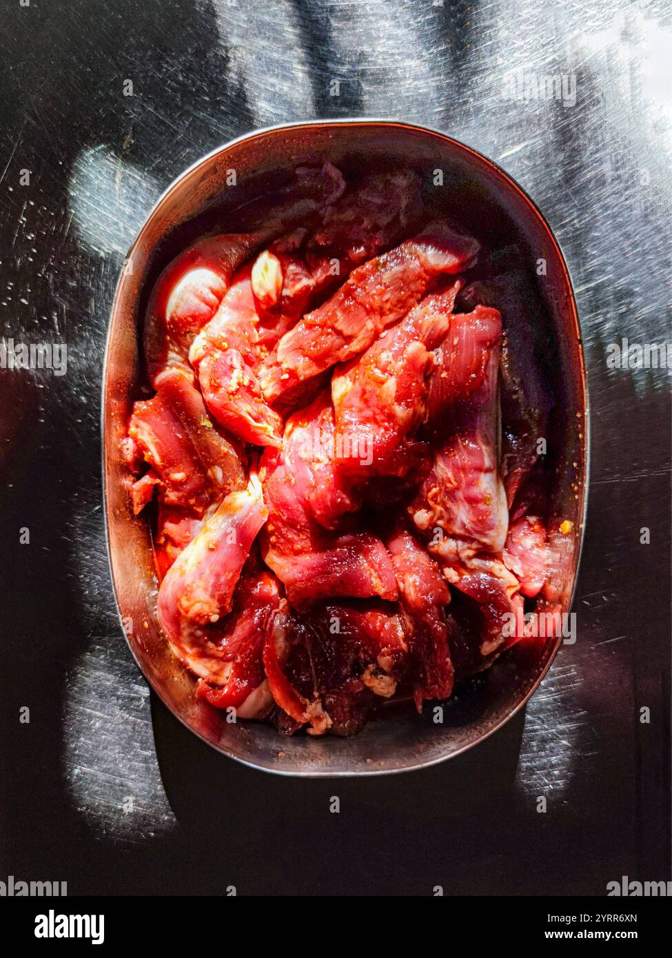 Raw lamb fillet in marinade Stock Photo - Alamy