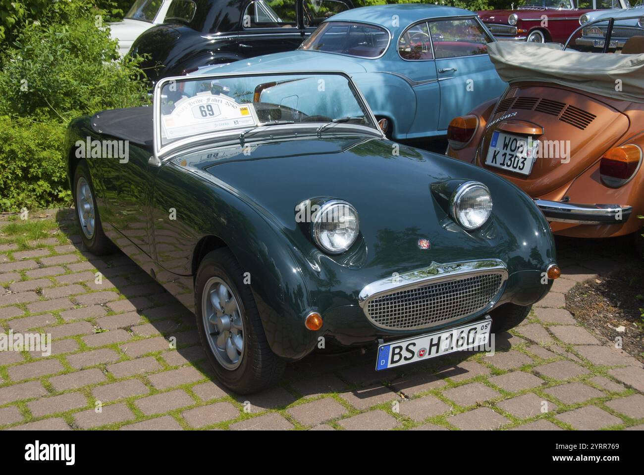 Green roadster classic car with open top at sunny exhibition, classic ...