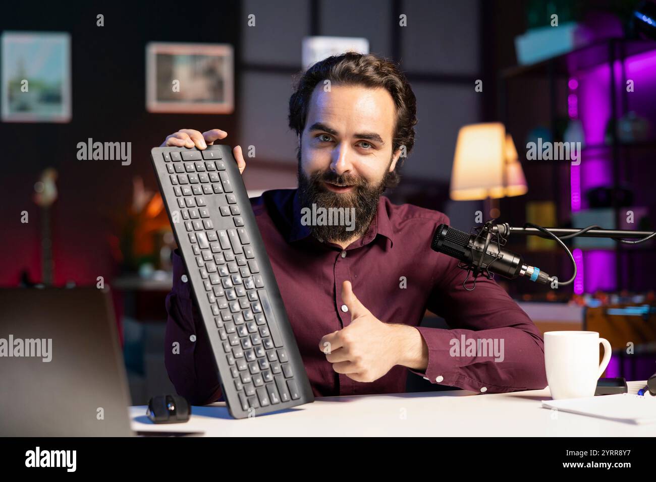 Influencer endorsing wireless keyboard from sponsor, showing thumbs up ...