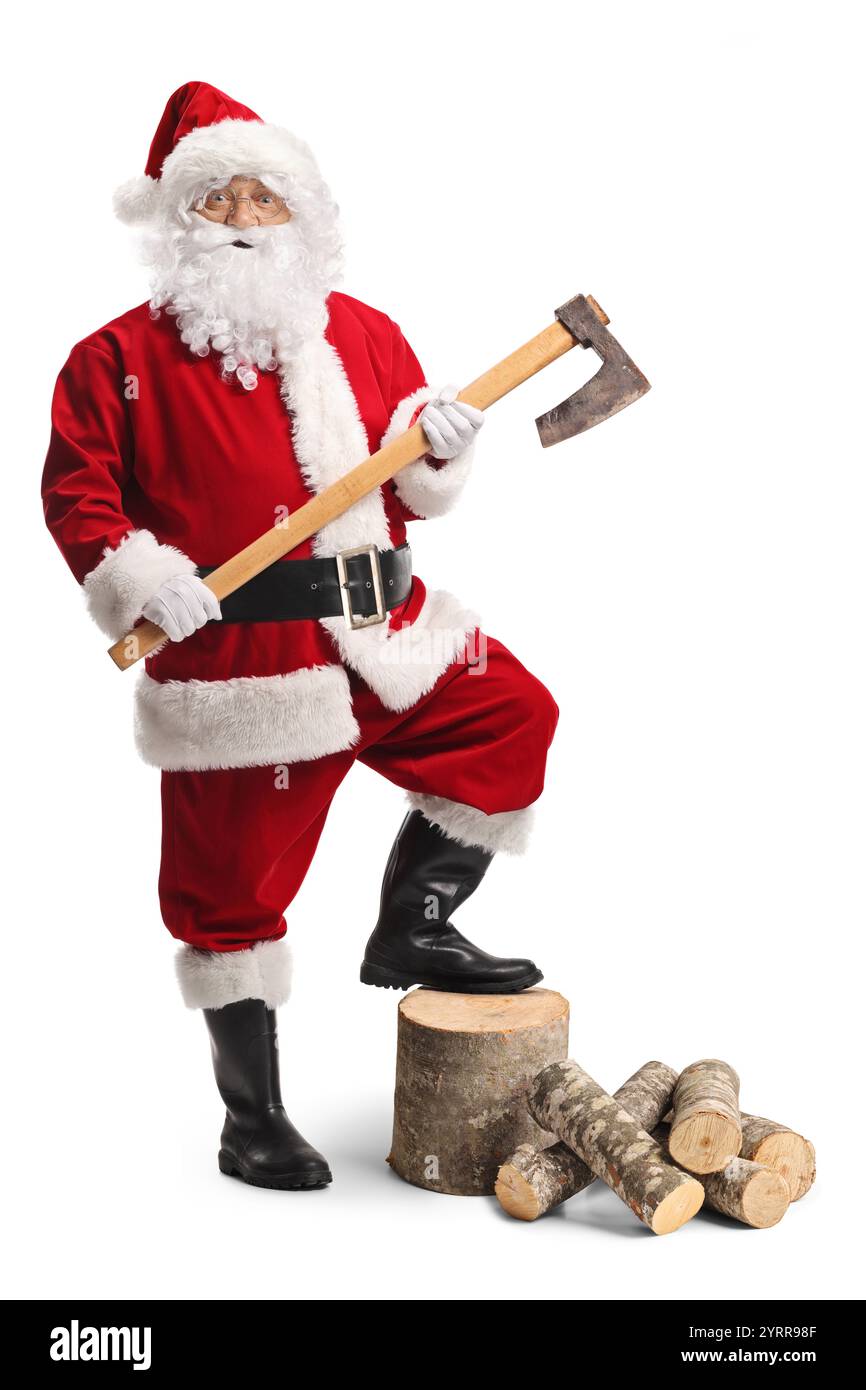Santa claus chopping firewood with an axe isolated on white background ...