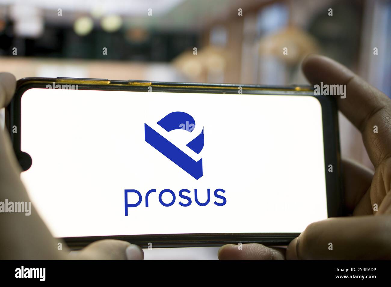 In this photo illustration, the Prosus logo is displayed on a ...