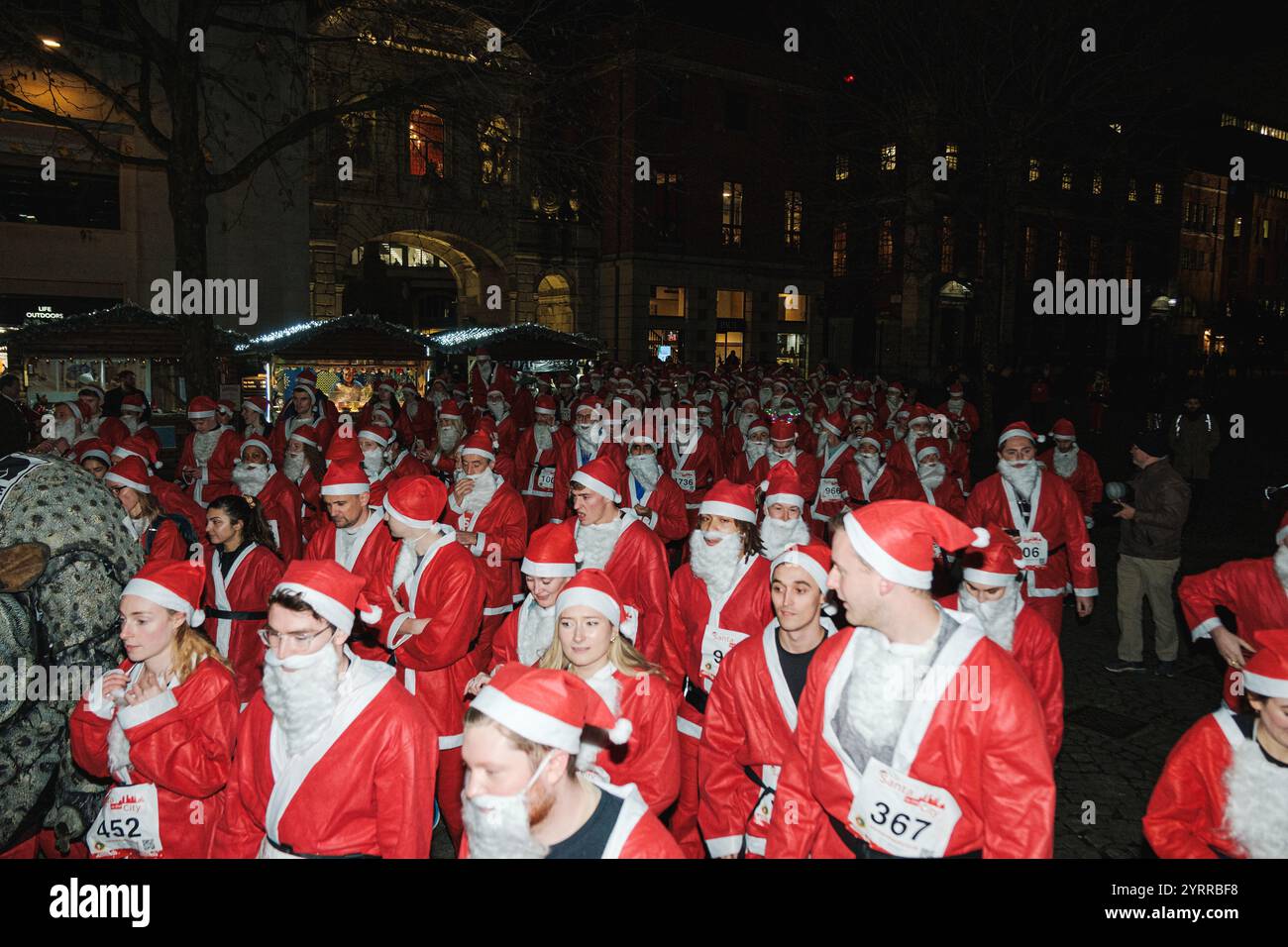 Hundreds of people dress up as Santa Claus for the Santa Run London ...