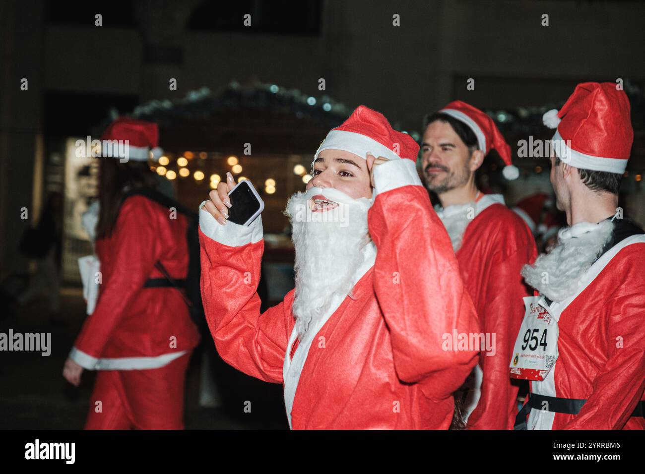 Hundreds of people dress up as Santa Claus for the Santa Run London ...