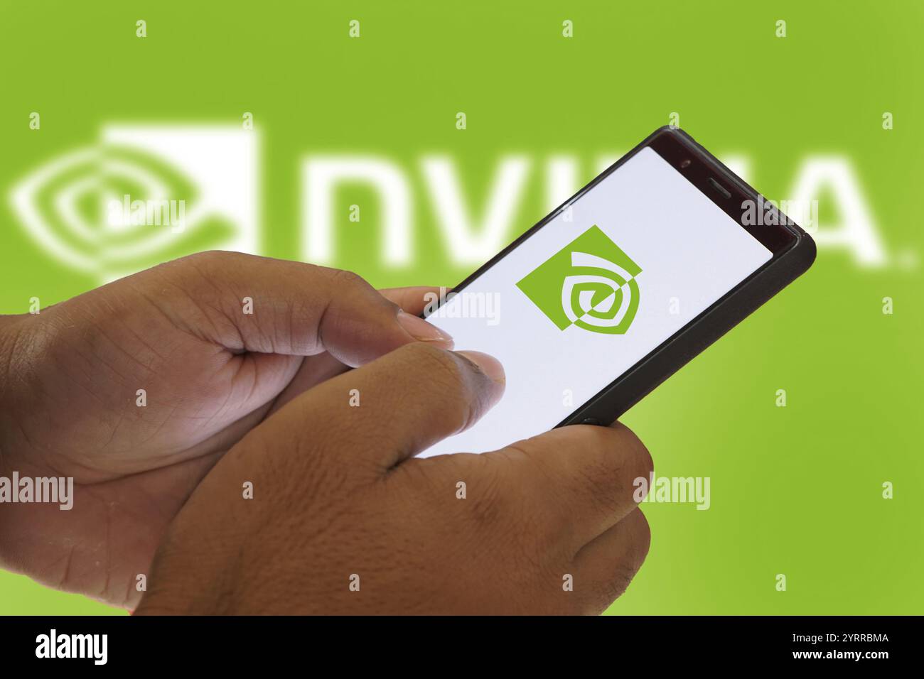 Nvidia logo on smartphone screen with AI in the background. Nvidia ...