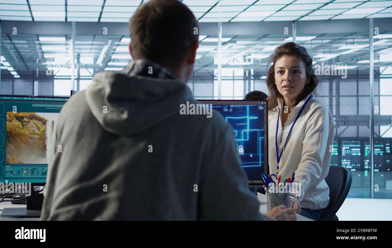 Engineer In Server Room Chitchatting With Colleague While Making Ai