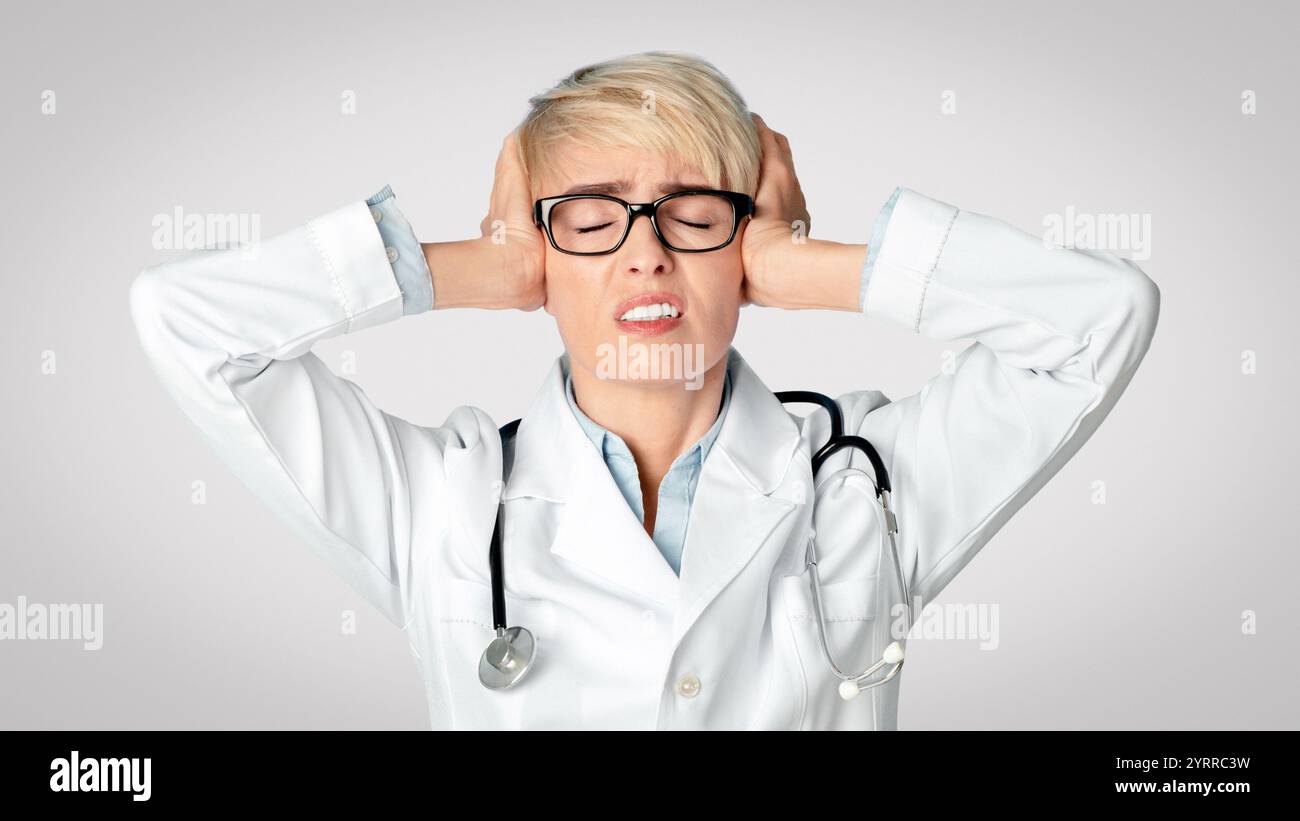 Medical problems, overwork or coronacrisis. Sad woman doctor in white ...