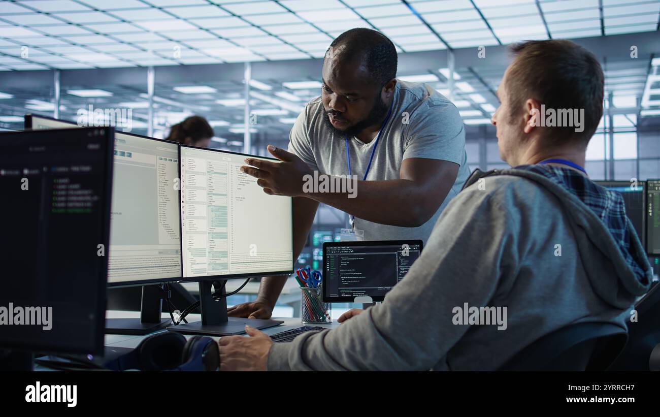 Engineer having fun with colleague at work in data center establishment ...