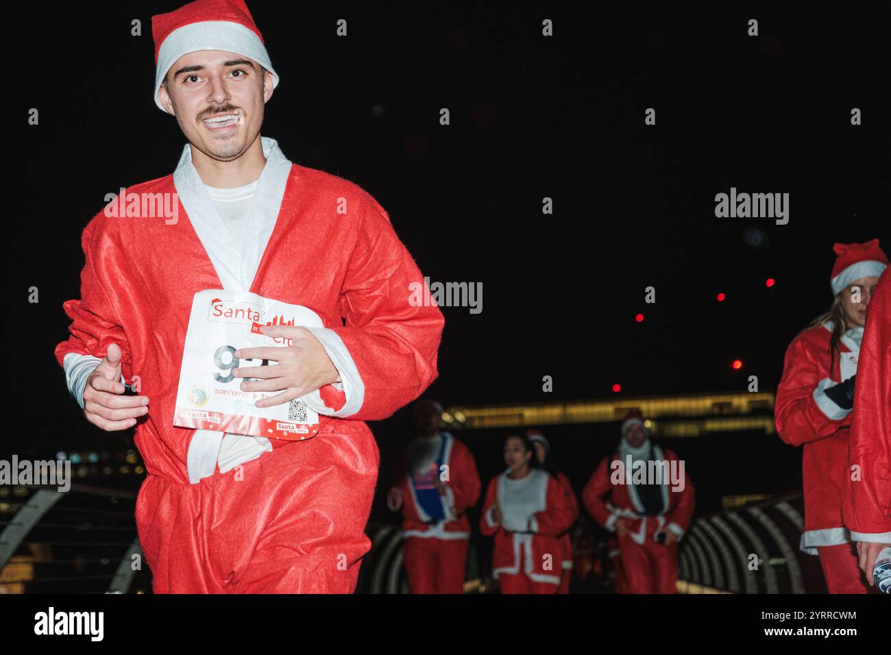 Hundreds of people dress up as Santa Claus for the Santa Run London ...