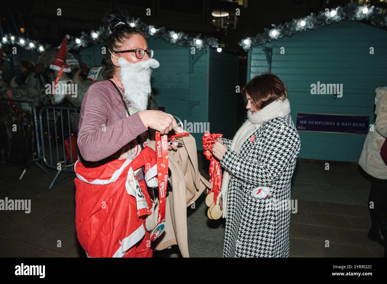 Hundreds of people dress up as Santa Claus for the Santa Run London ...