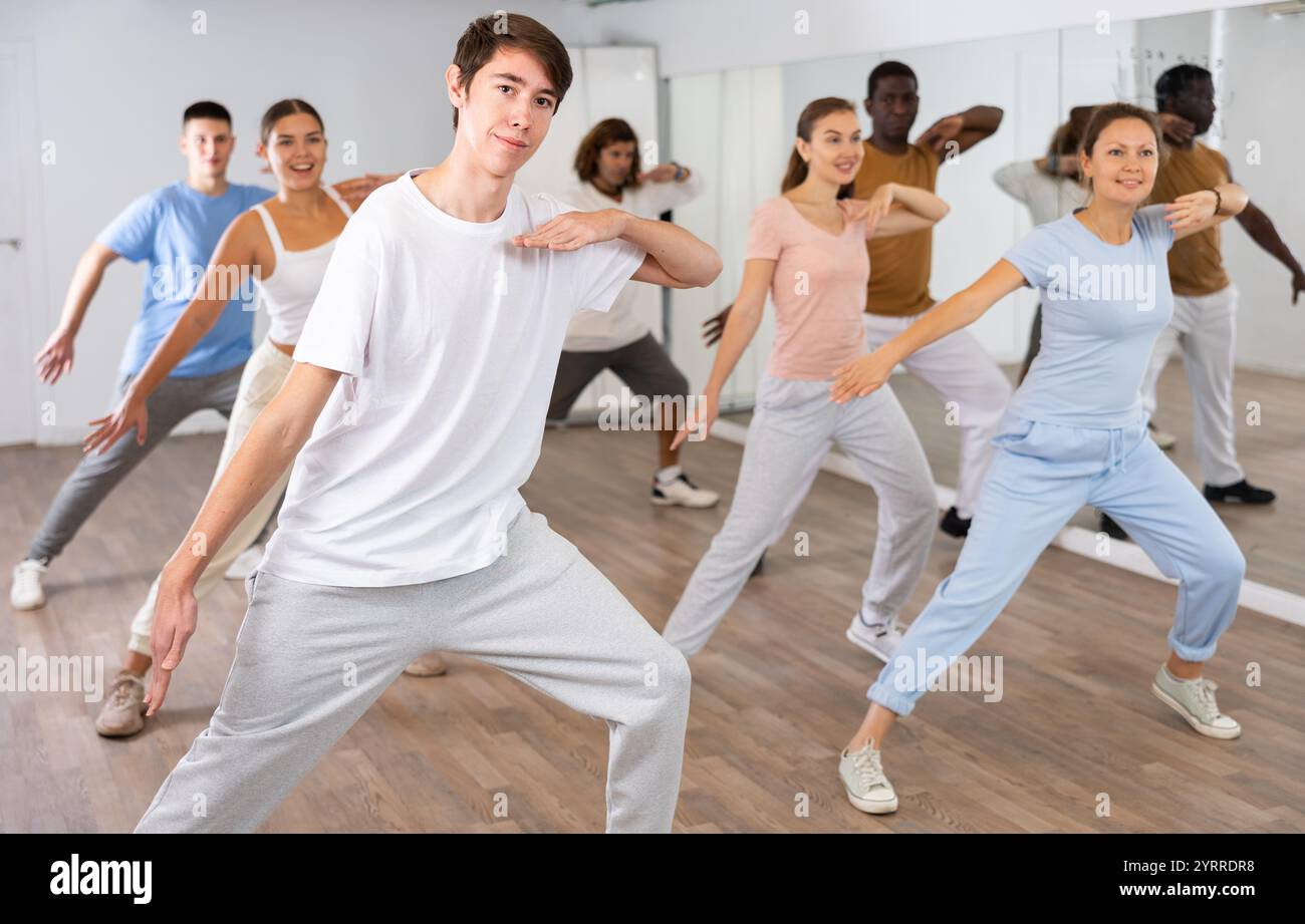 Happy active energetic multiracial dancers of different ages dancing ...